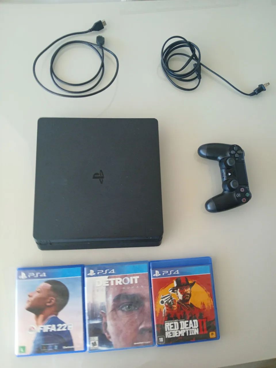 Ps4 slim com um controle + 3 jogos: red dead, FIFA 22 e Detroit become ...