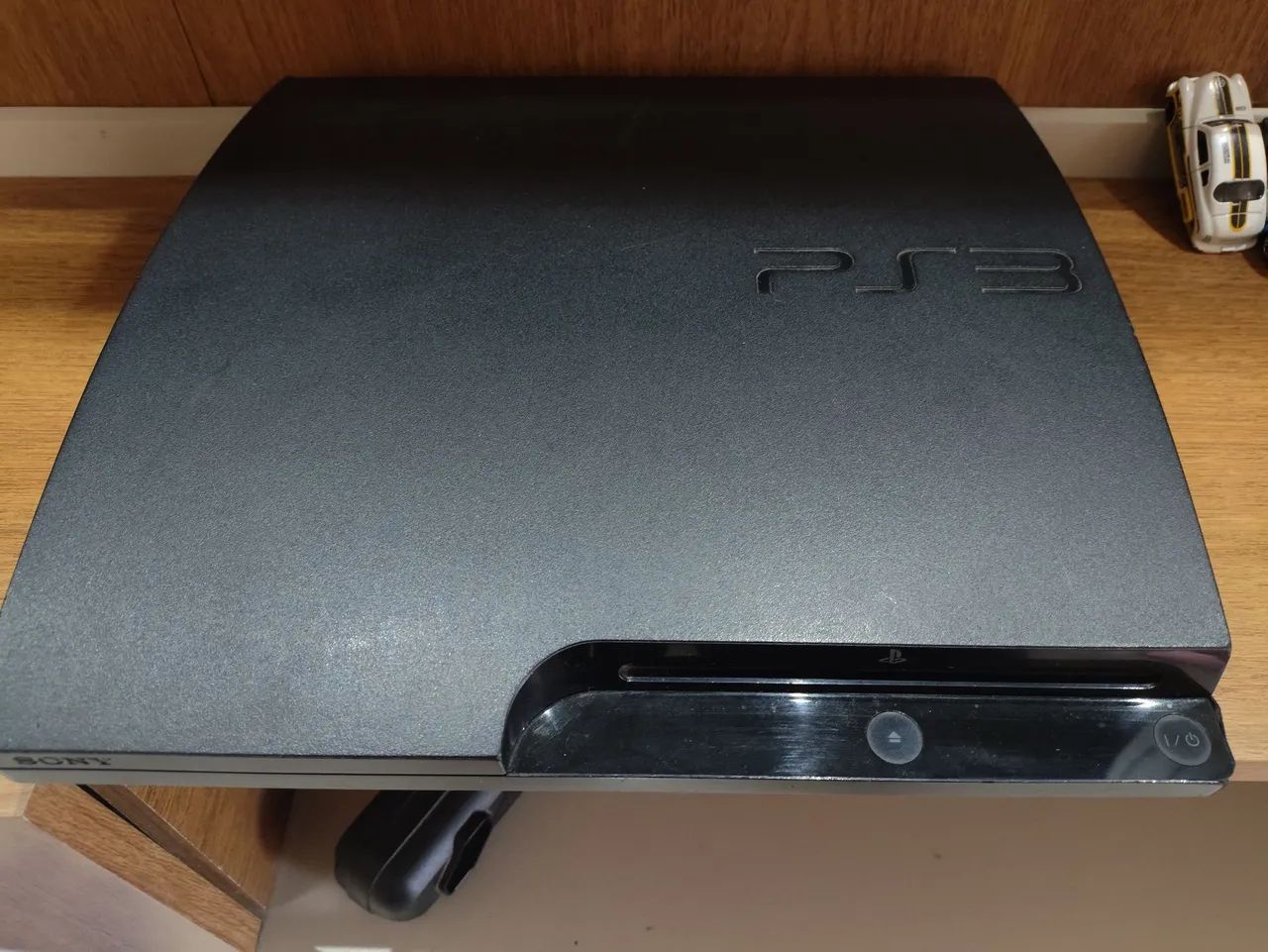 PS3 slim + 10 jogos originais ( GTA V, God Of War,Batman e ...