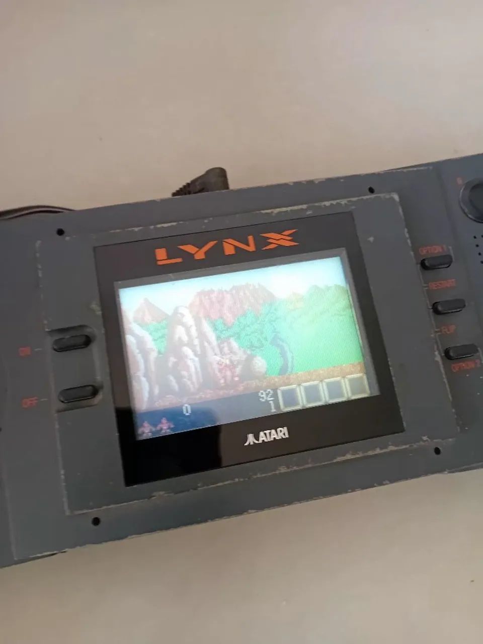 Atari lynx primeiro modelo com rygar e fonte - Peças e Acessórios de ...