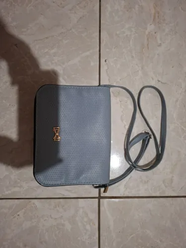 "bolsa azul claro" no Brasil